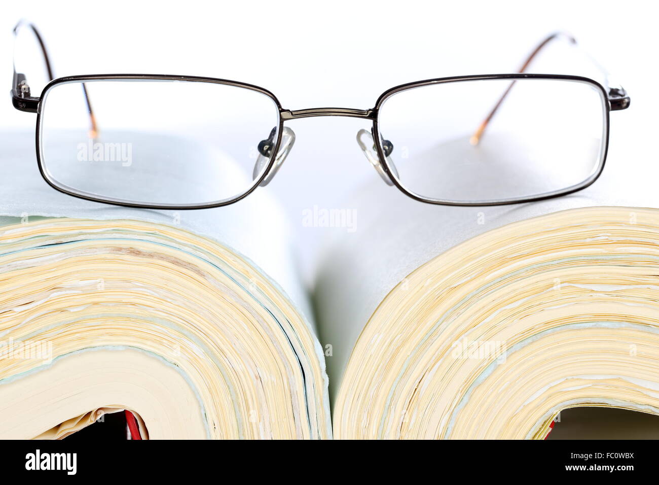 open book with glasses Stock Photo - Alamy