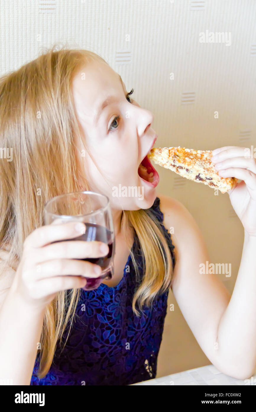 Eating cute girl Stock Photo - Alamy