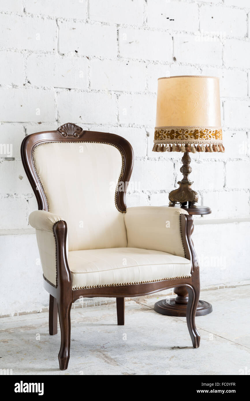 White Retro Chair with Lamp Stock Photo - Alamy