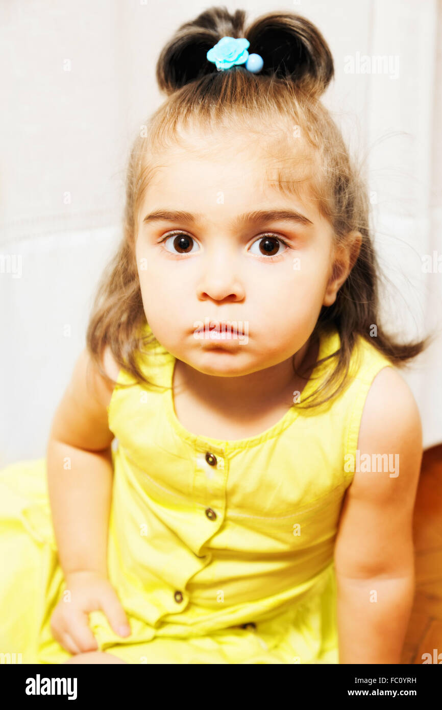 Little kid sitting on floor hi-res stock photography and images - Alamy
