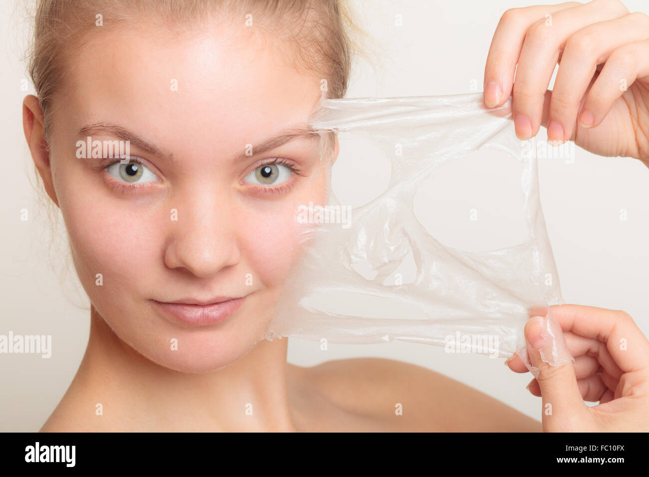 Removing peel off mask hi-res stock photography and images - Alamy