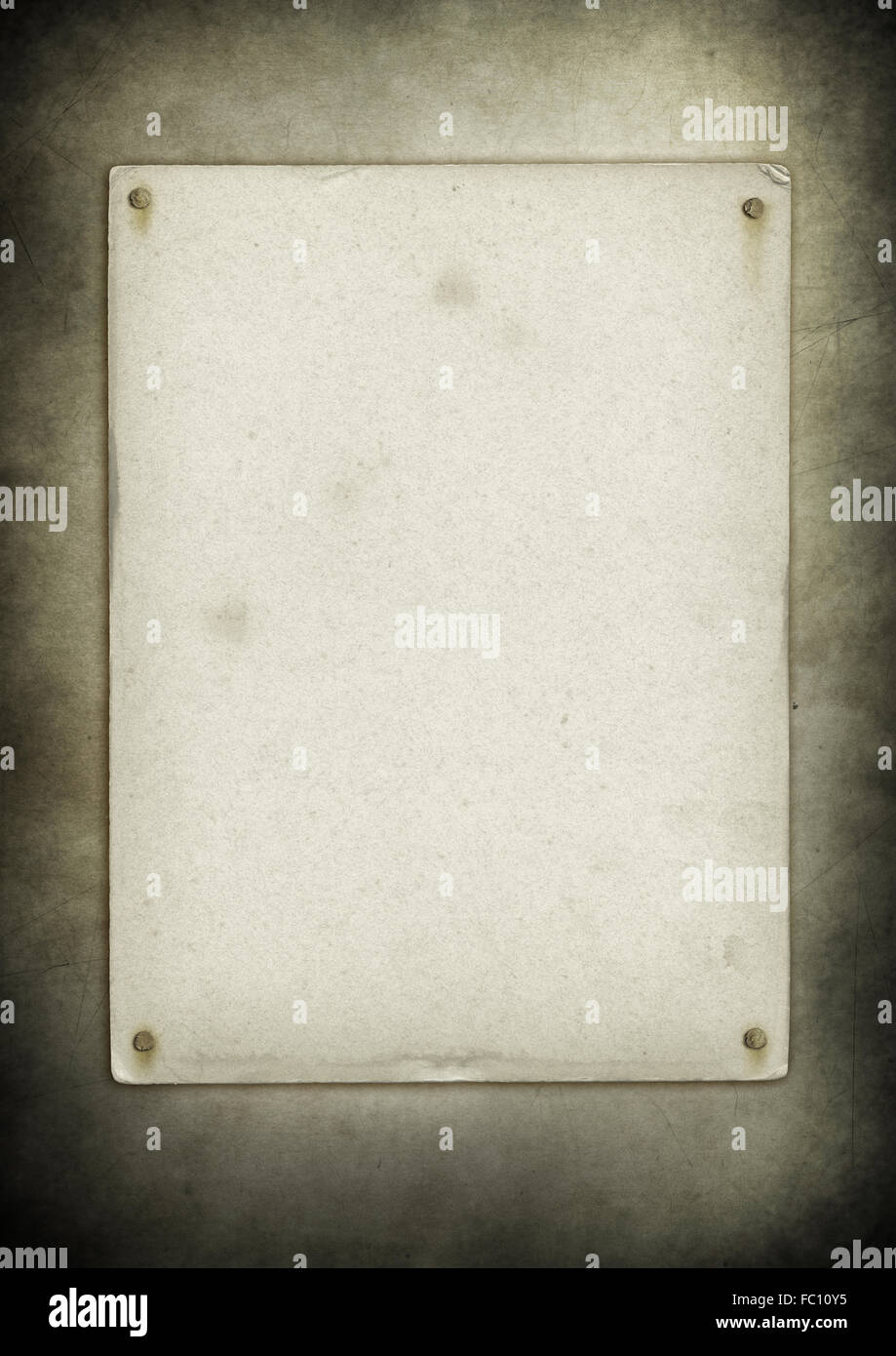 Blank old poster nailed on a grunge wall Stock Photo - Alamy