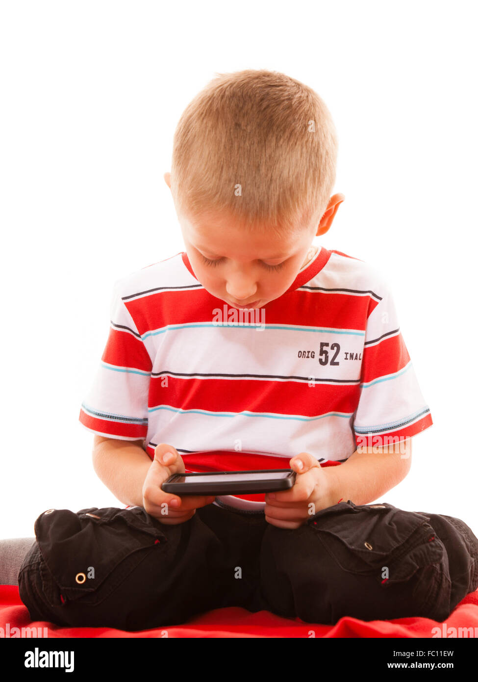 Little boy playing games on smartphone Stock Photo - Alamy