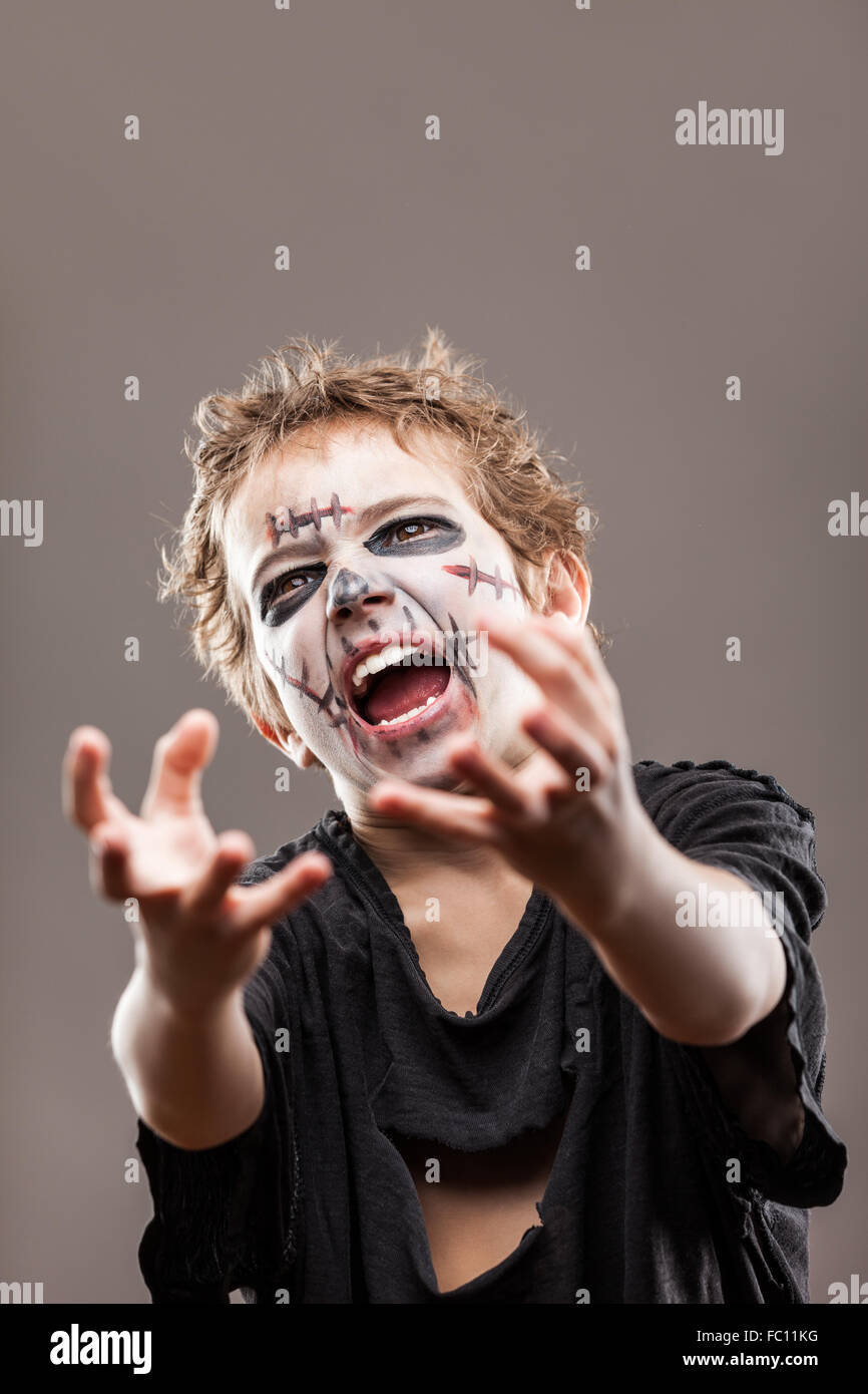 Screaming walking dead zombie child boy Stock Photo - Alamy