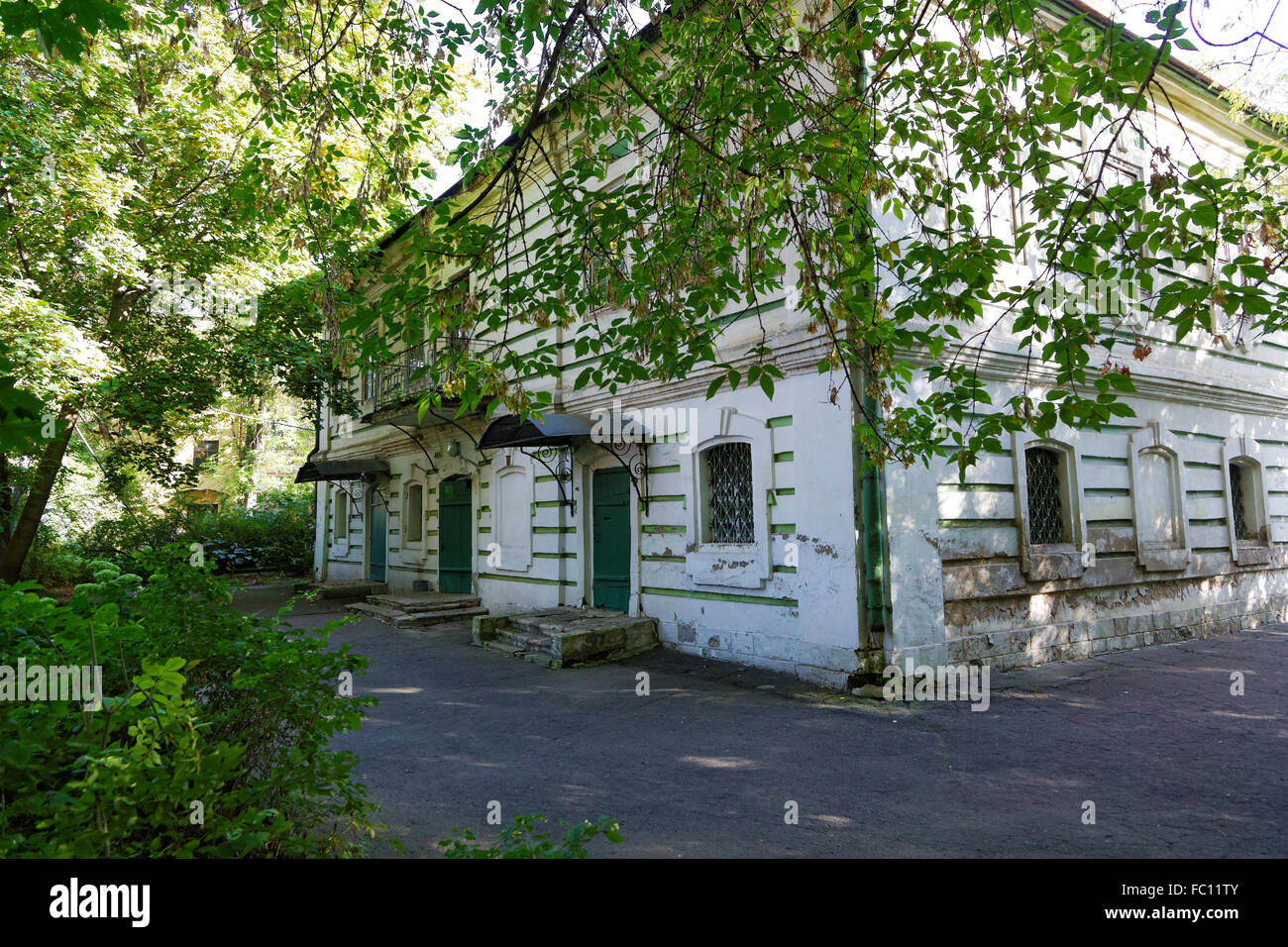 The ancient house with trees Stock Photo - Alamy