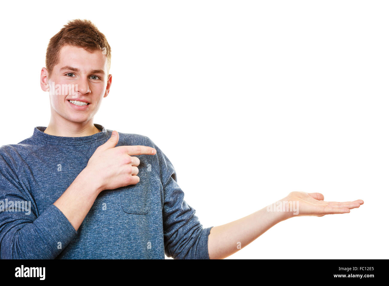 Young man holding open palm showing copy space Stock Photo - Alamy
