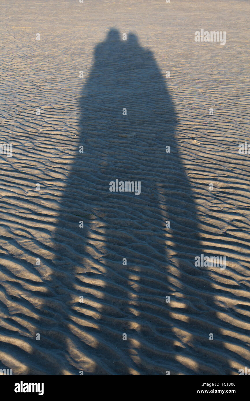 Two shadows in the sand Stock Photo - Alamy