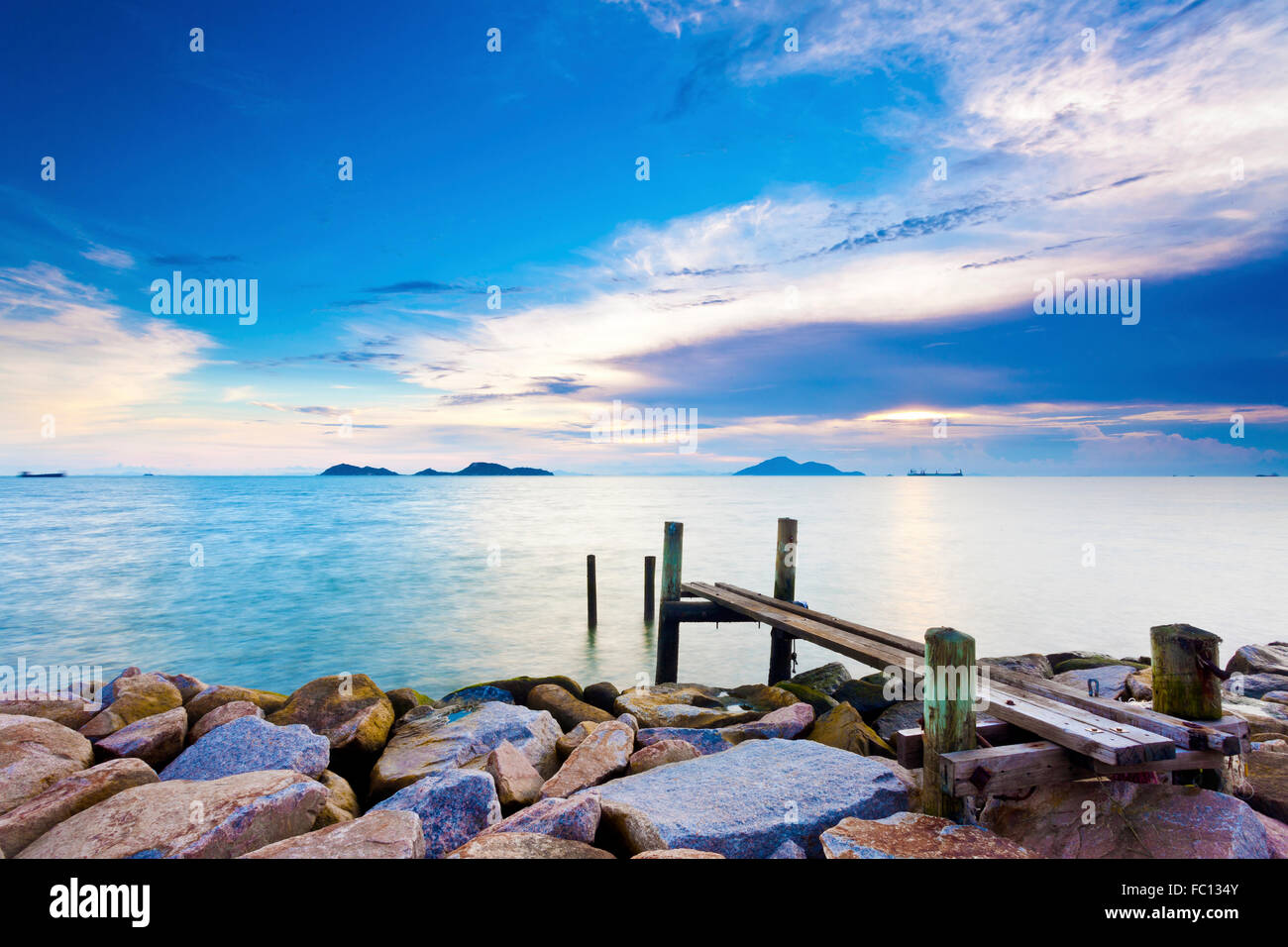 Old harbor jetty sunset hi-res stock photography and images - Alamy