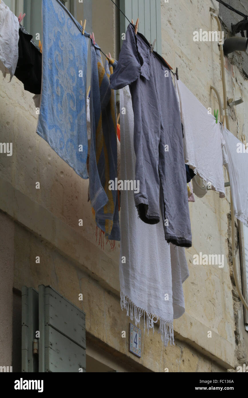 clothes in front of a window Stock Photo - Alamy