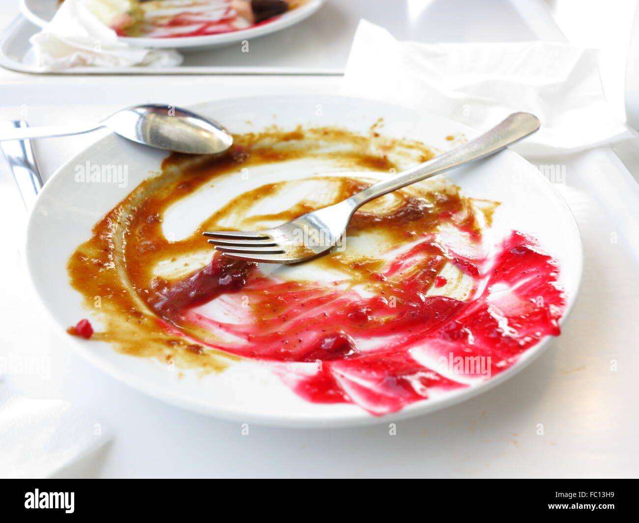 Empty plate dirty after dinner Stock Photo - Alamy
