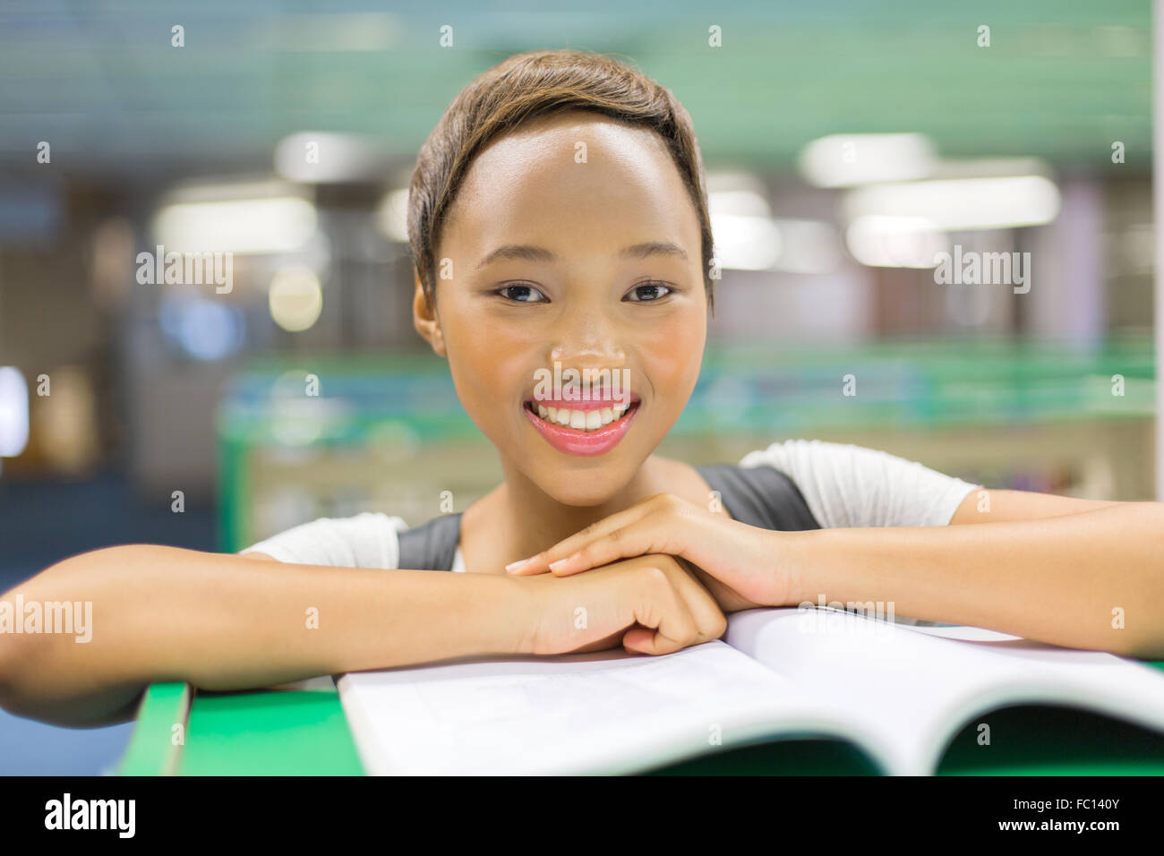 portrait of beautiful young college student reading a book Stock Photo ...