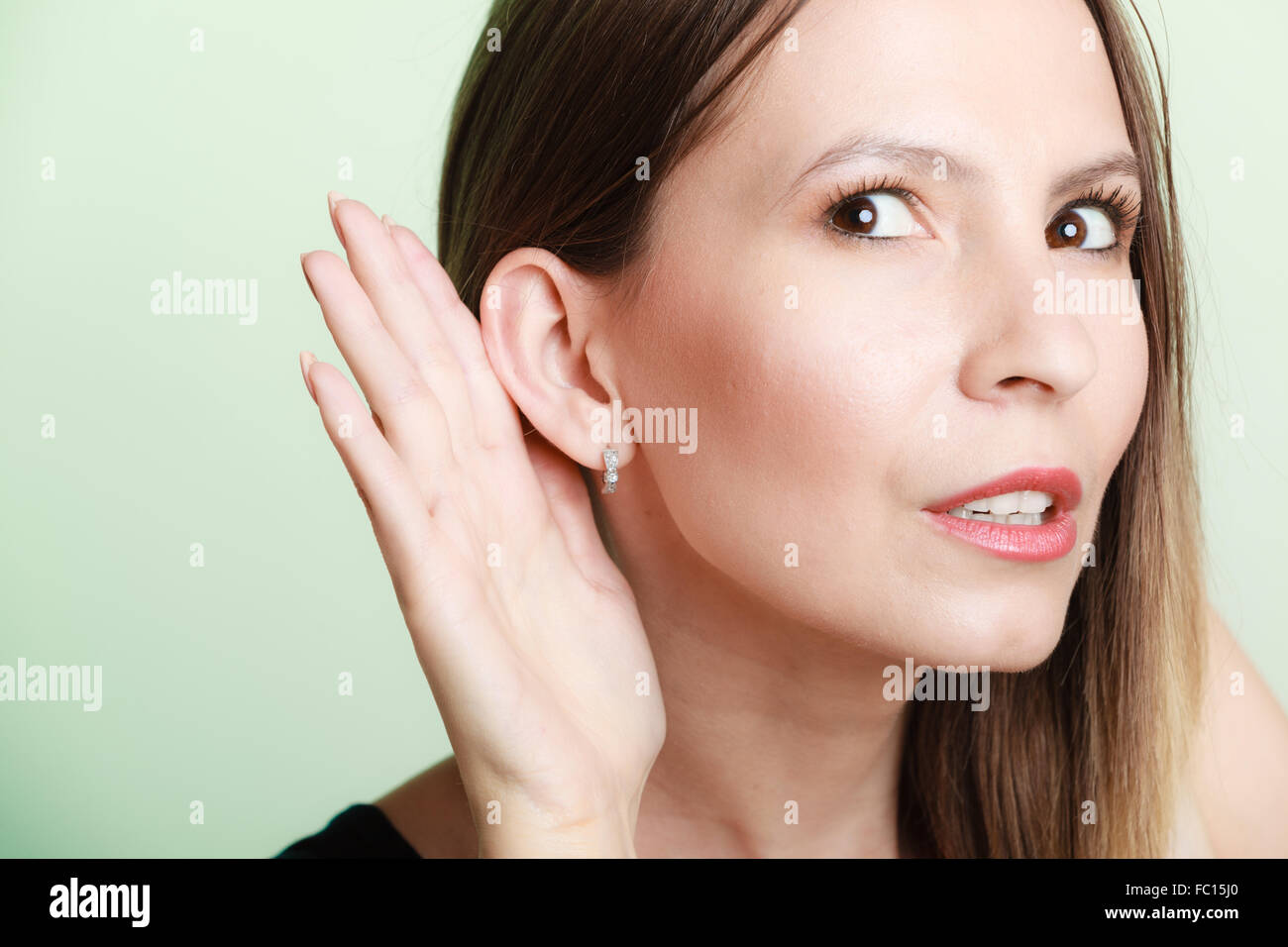 Hand behind ear hi-res stock photography and images - Alamy