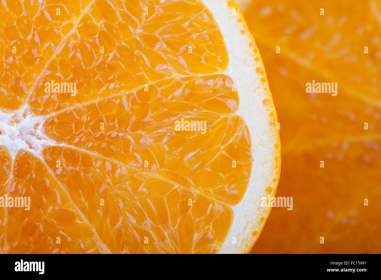 slice of two oranges macro closeup Stock Photo - Alamy