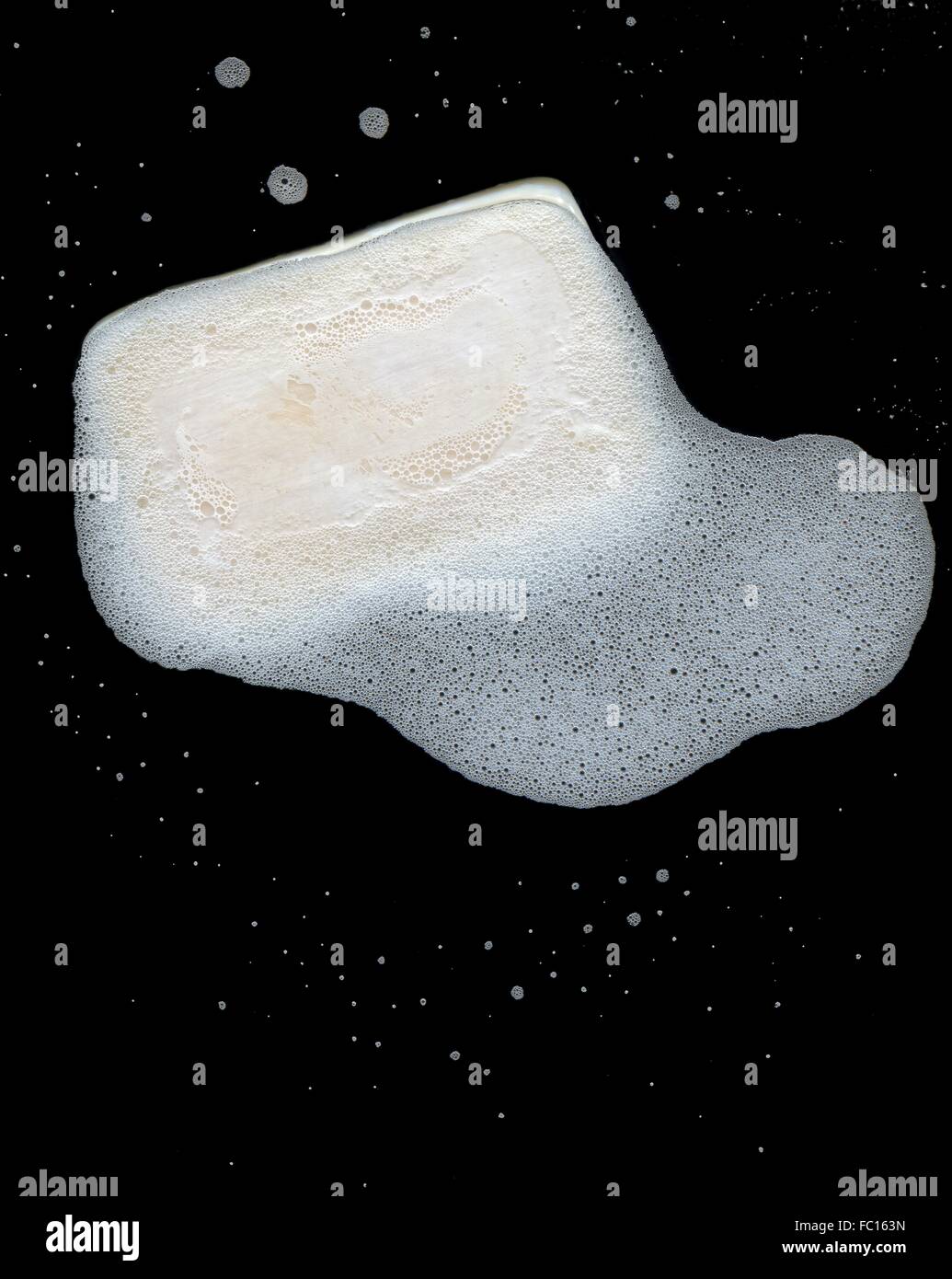 soap with lather on black background Stock Photo - Alamy