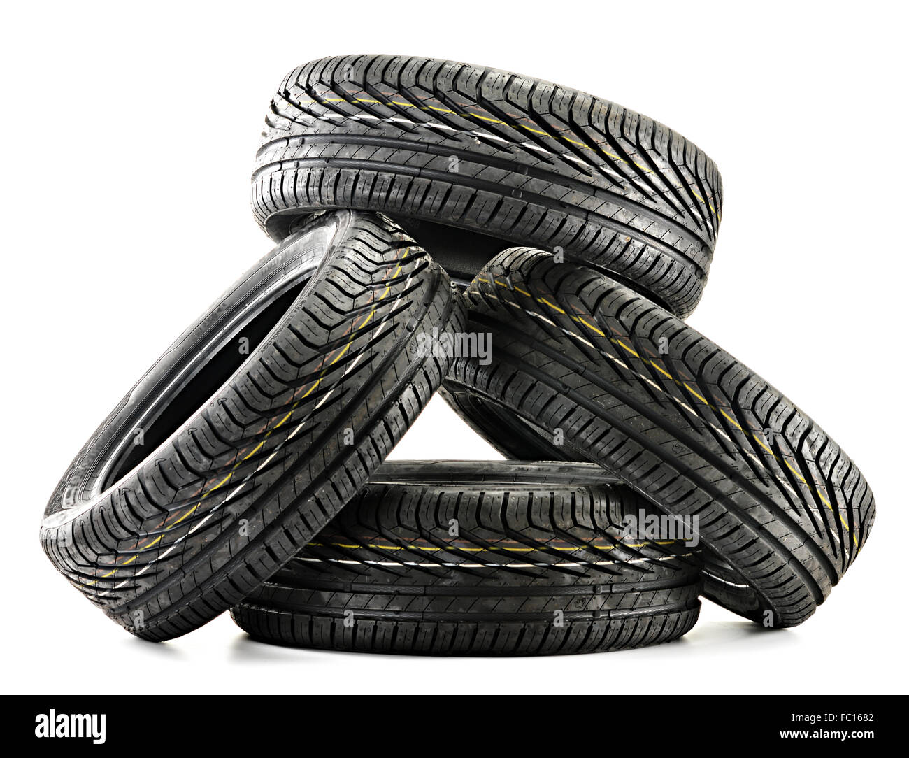 Four new black tires isolated on white Stock Photo - Alamy