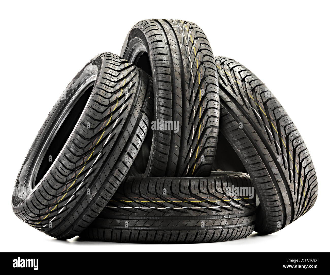 Four new black tires isolated on white Stock Photo - Alamy