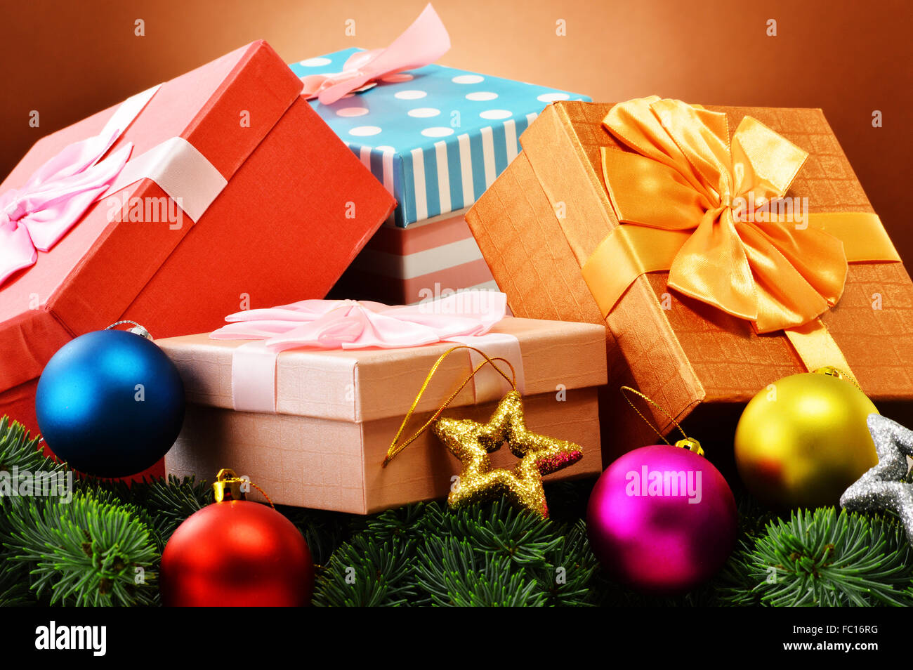 Colorful gift boxes and christmas tree Stock Photo - Alamy