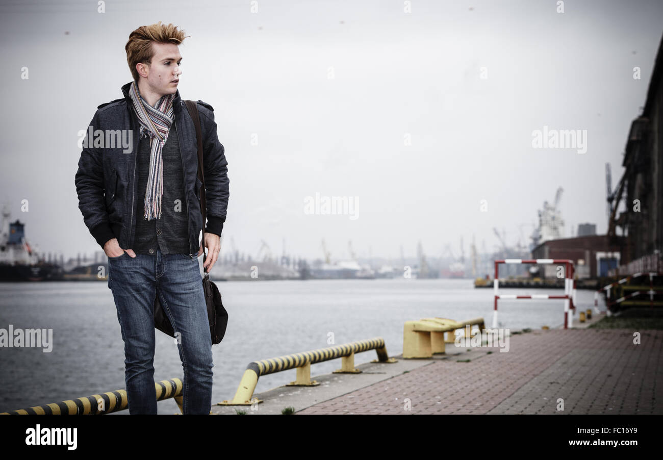 fashion model guy with bag outdoors Stock Photo - Alamy
