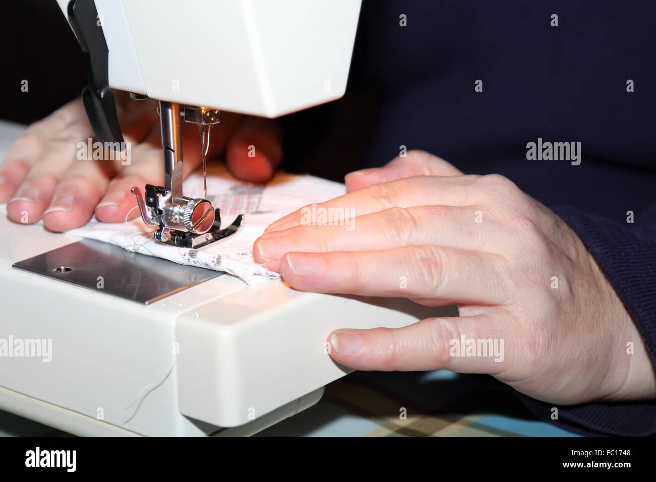 Person retro sewing machine hi-res stock photography and images - Alamy