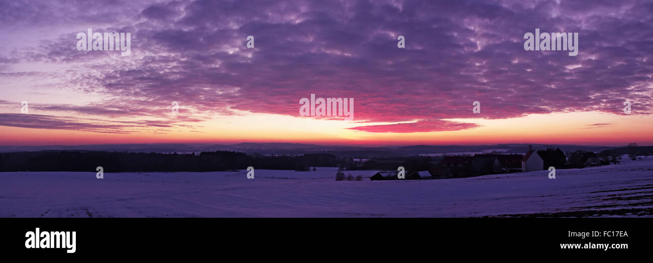 Winter Landscape with Clouds at Sunset Stock Photo - Alamy