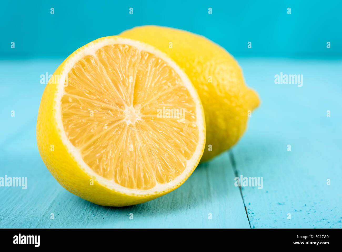 Fresh Yellow Lemons On Turquoise Table Stock Photo - Alamy