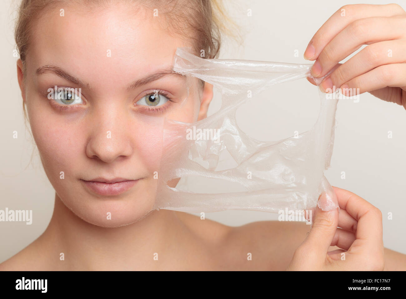 Removing peel off mask hi-res stock photography and images - Alamy