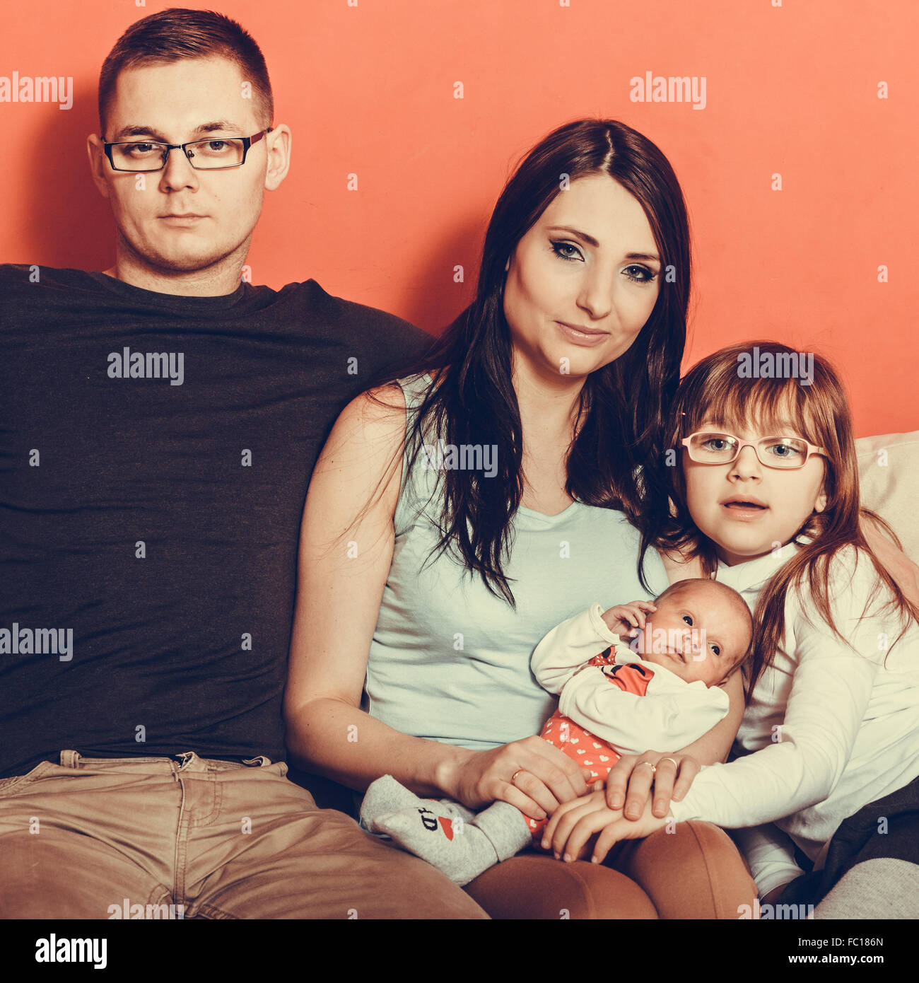Family with baby sofa hi-res stock photography and images - Alamy
