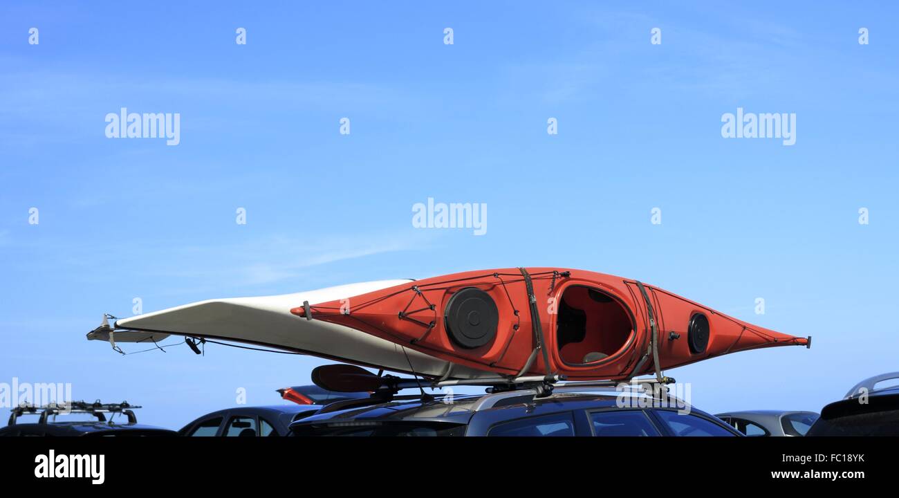 car with kayak canoe on top blue sky. Active lifestyle Stock Photo - Alamy