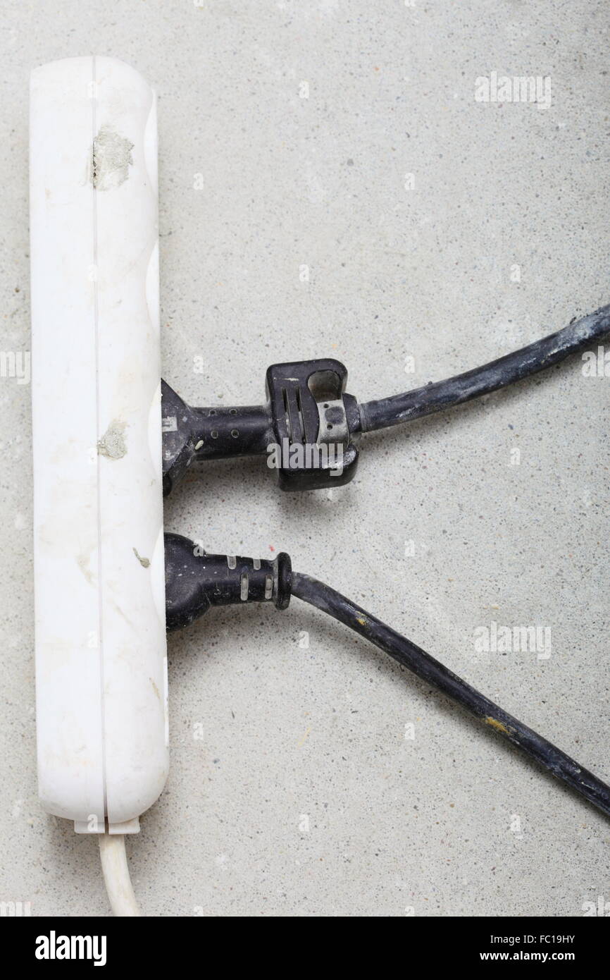 electrical cords connected to power strip building site Stock Photo - Alamy