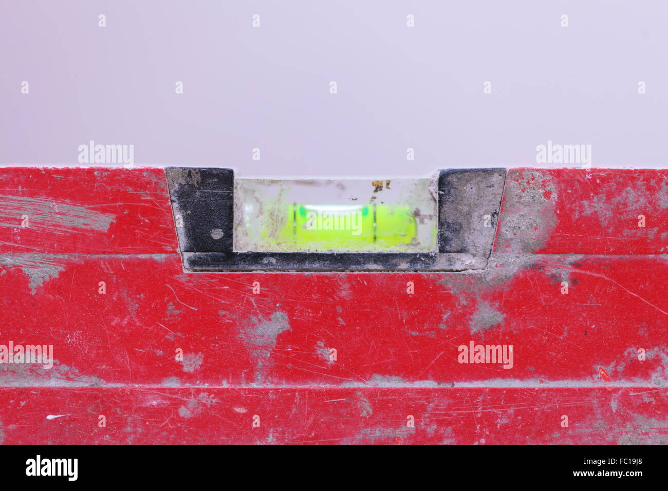 Red spirit building level in construction site Stock Photo - Alamy