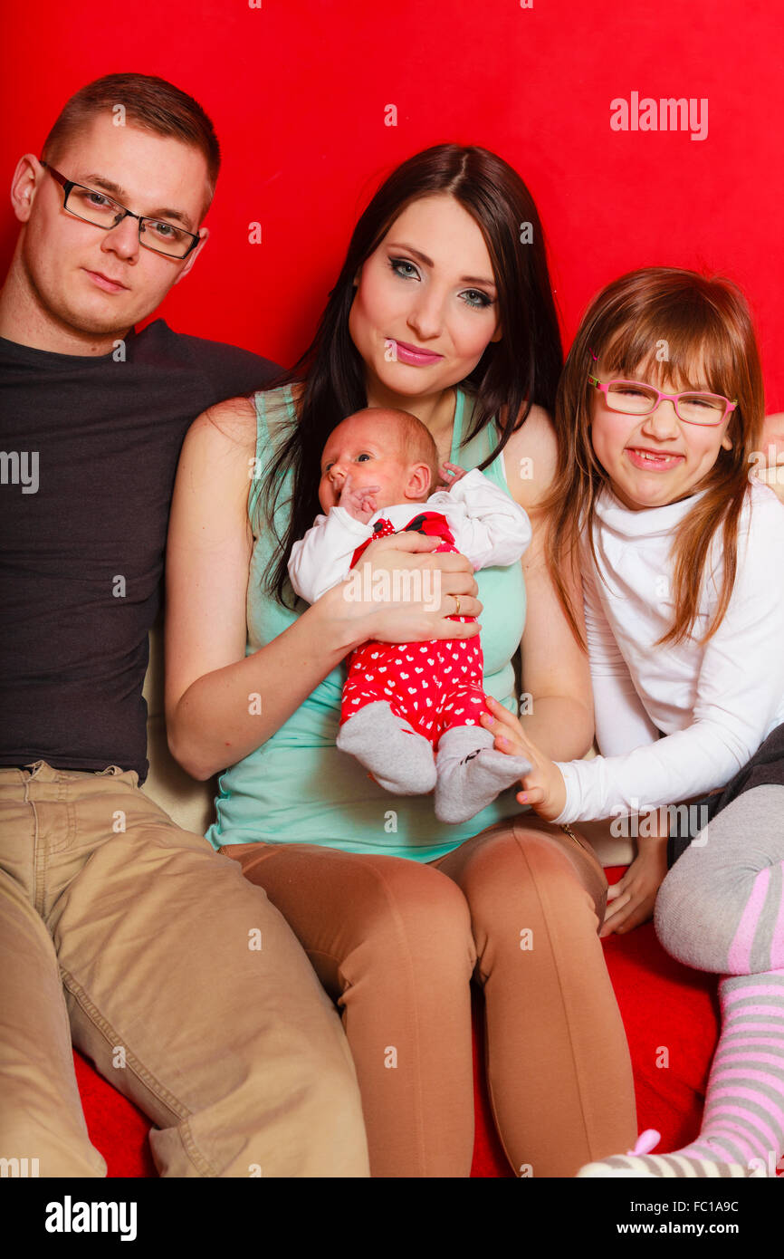 Family with newborn baby girl portrait Stock Photo - Alamy