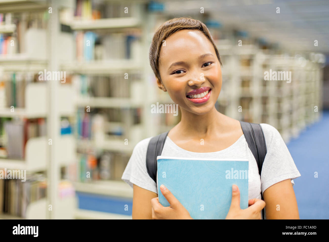 close up portrait of pretty African American university student in ...