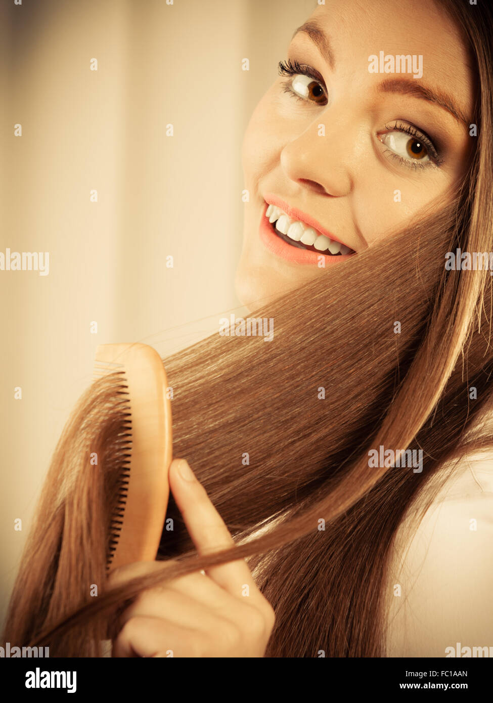 beautiful woman with long hair and comb Stock Photo - Alamy