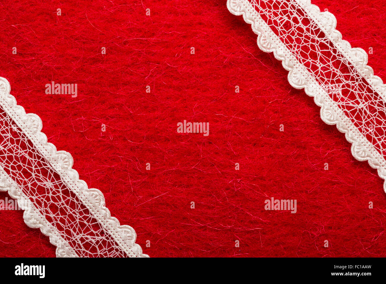 Vintage white lace over red background Stock Photo - Alamy