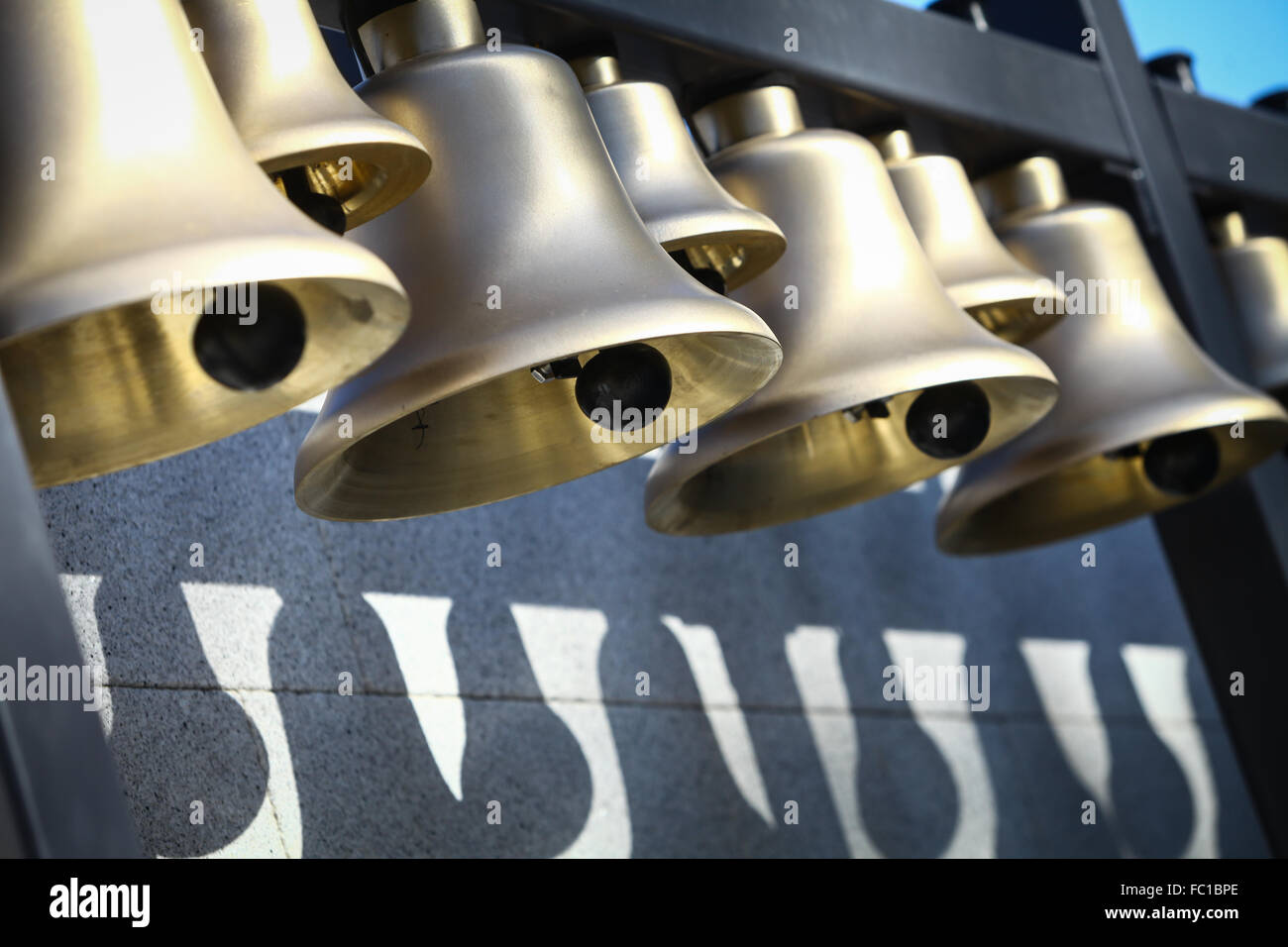 Color image of some various sized bells in a row Stock Photo - Alamy