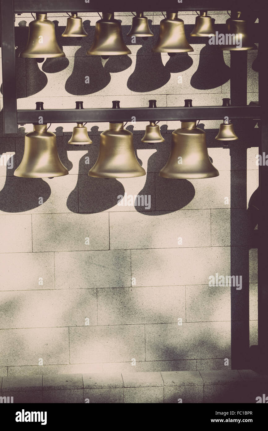 Color image of some various sized bells in a row Stock Photo - Alamy