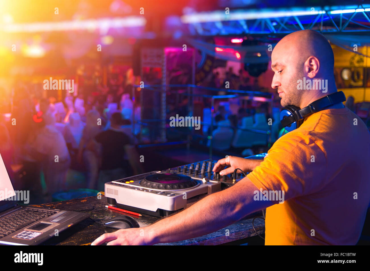 DJ behind the control panel Stock Photo - Alamy