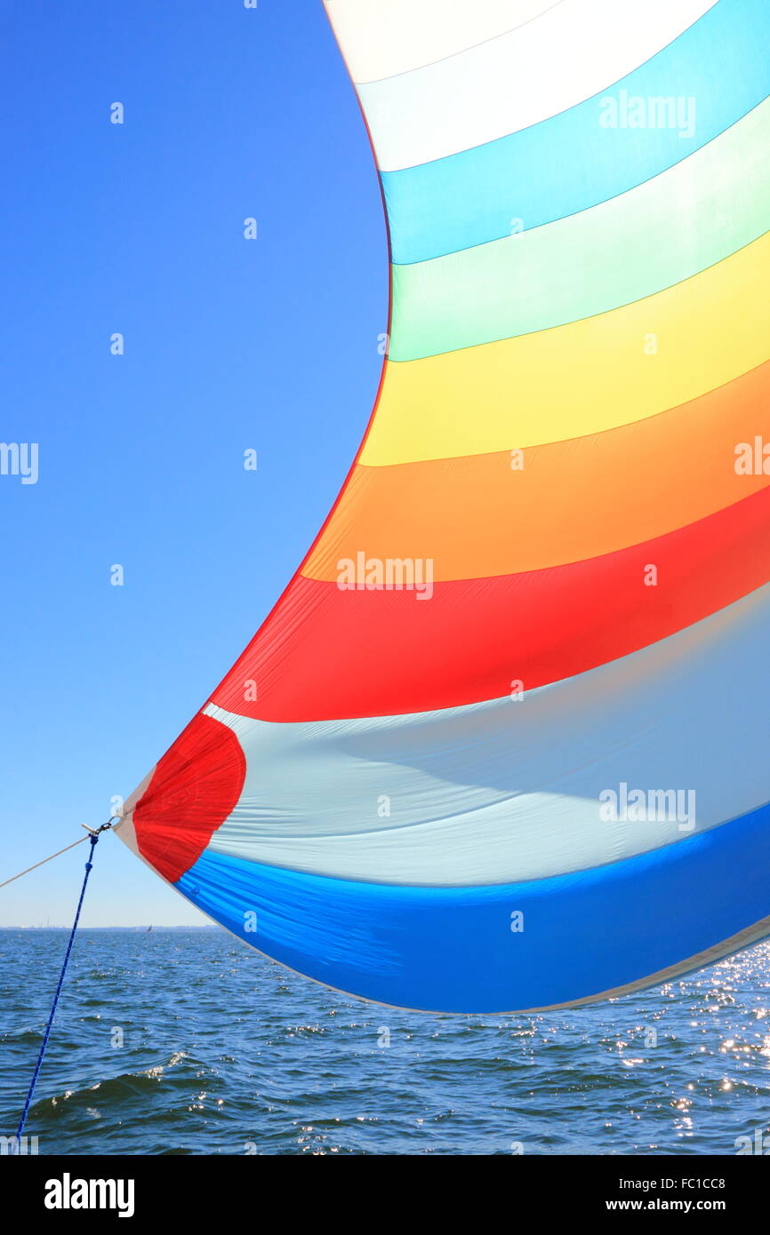 The wind has filled colorful spinnaker sail Stock Photo - Alamy