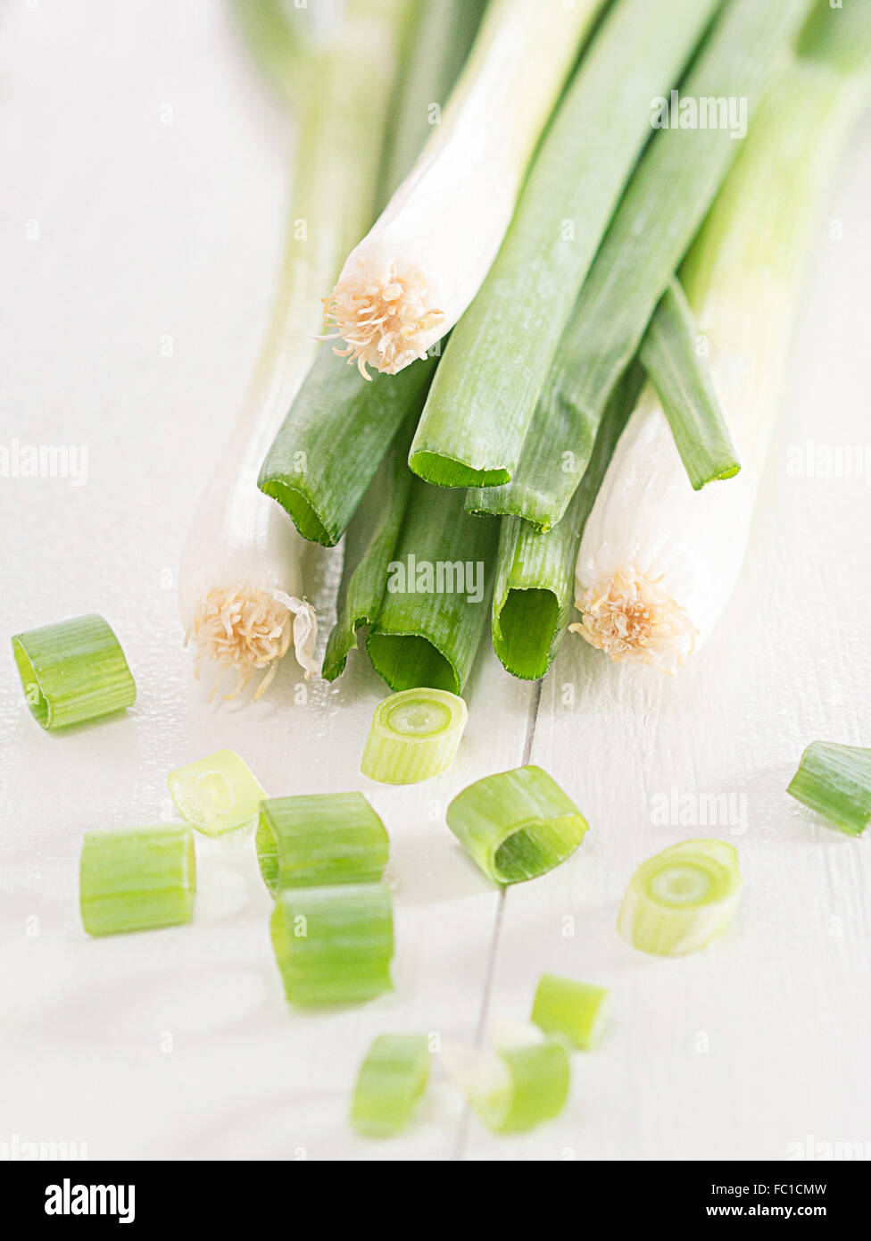 Spring onions on a tray Stock Photo - Alamy