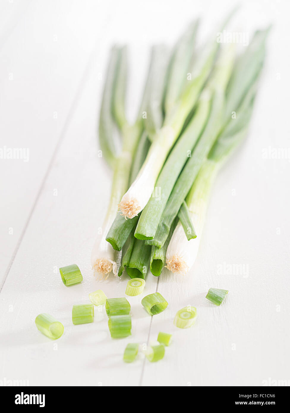 Spring onions on a tray Stock Photo - Alamy
