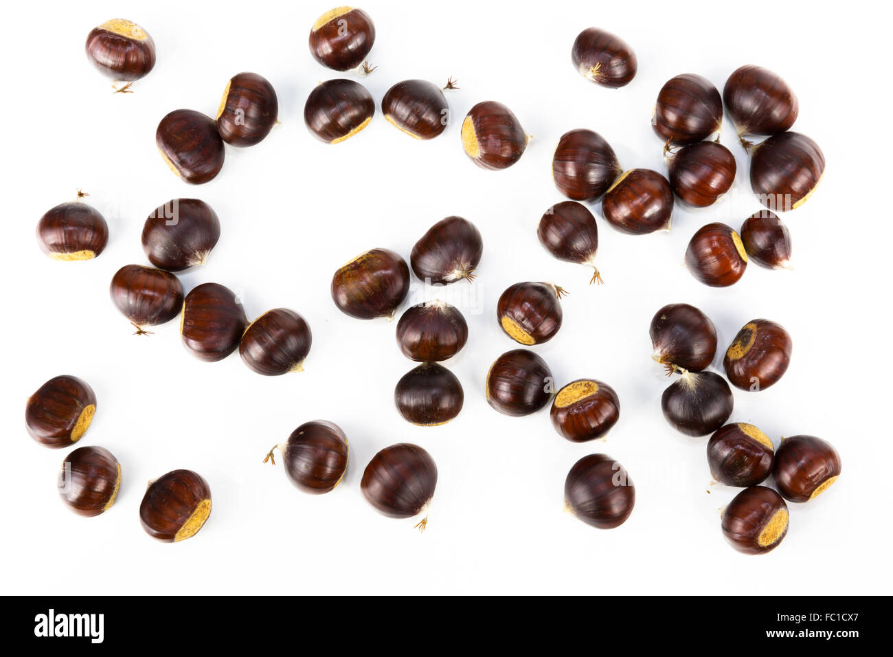 Sweet chestnuts on white background Stock Photo - Alamy