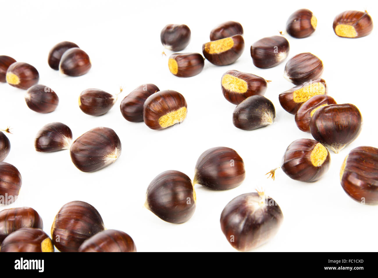 Sweet chestnuts on white background Stock Photo - Alamy