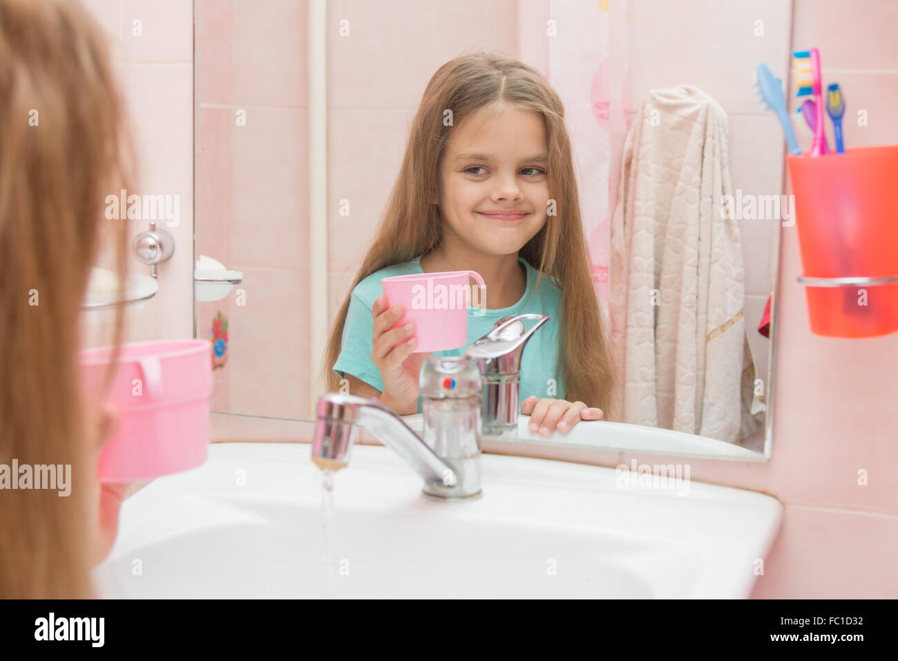 Girl rinsing toothpaste hi-res stock photography and images - Alamy