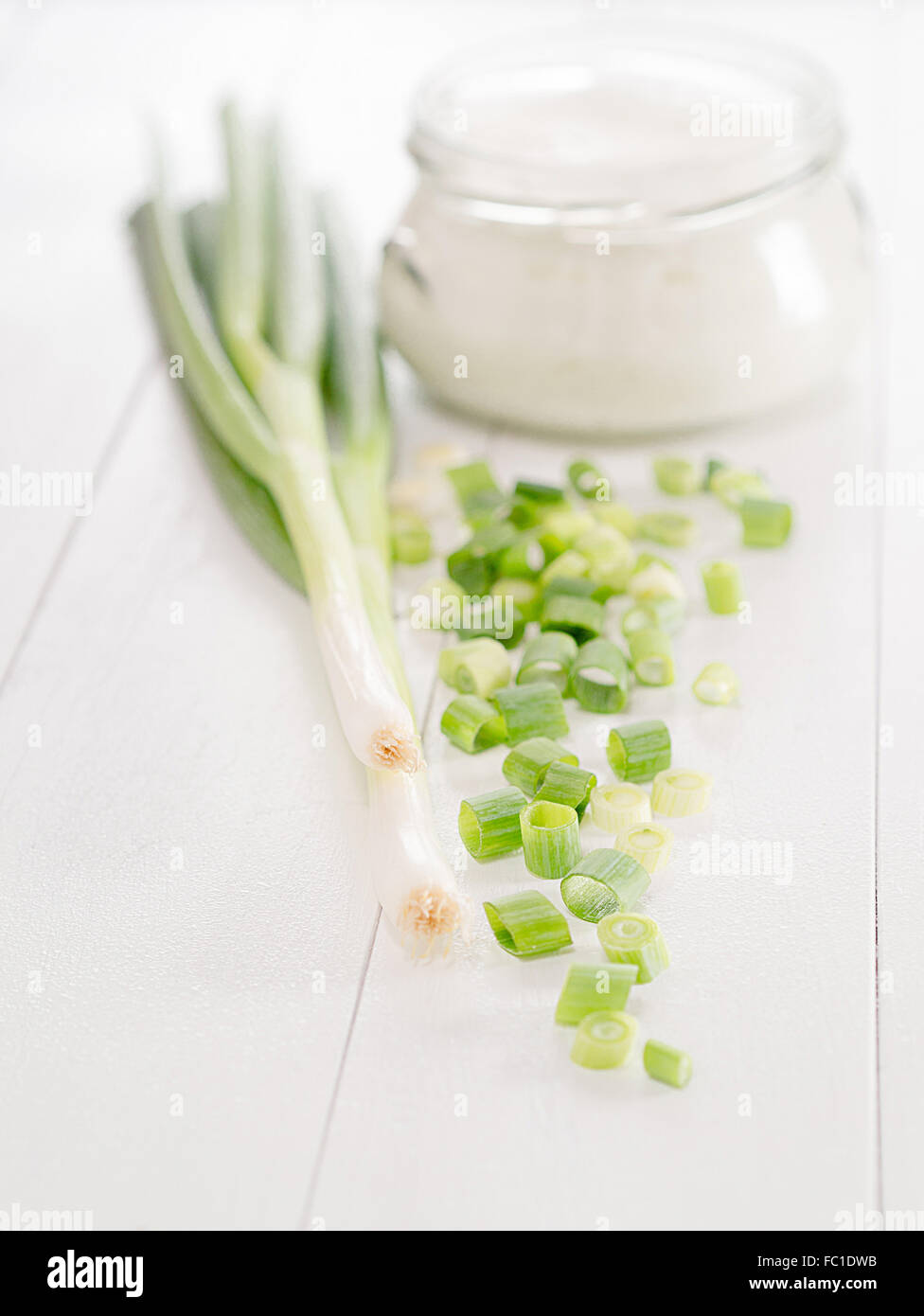 Spring onions on a tray Stock Photo - Alamy