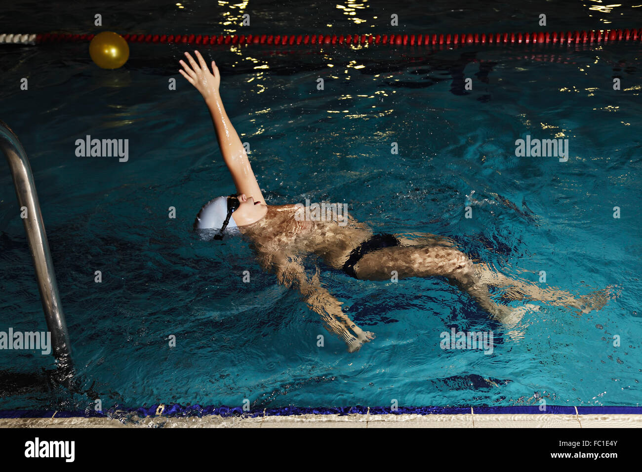 Kid swimming backstroke Stock Photo - Alamy
