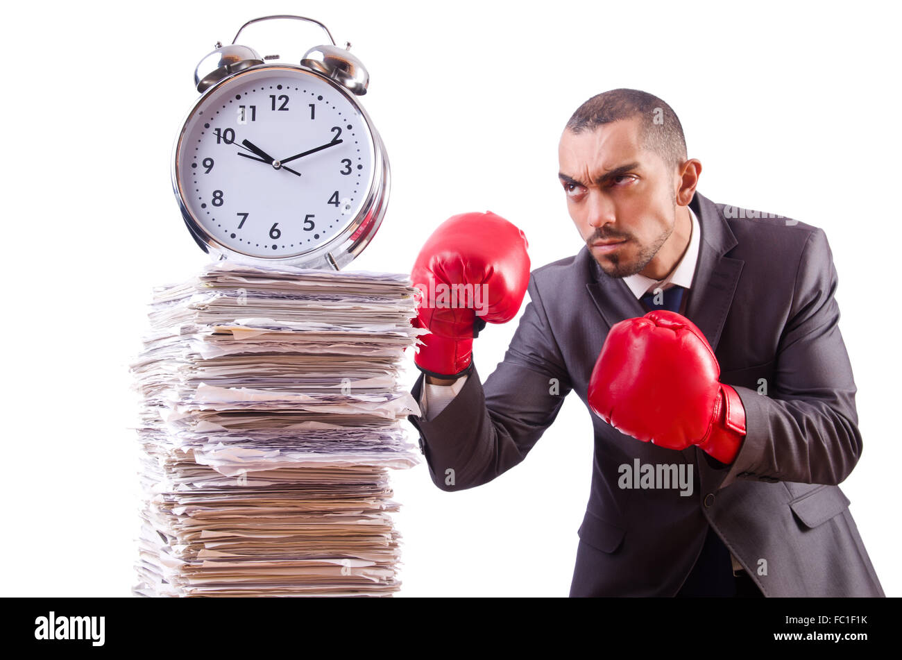 Angry businessman hitting clock isolated on white Stock Photo - Alamy