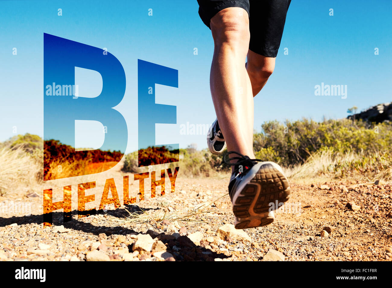 Composite image of athletic man jogging on country trail Stock Photo - Alamy