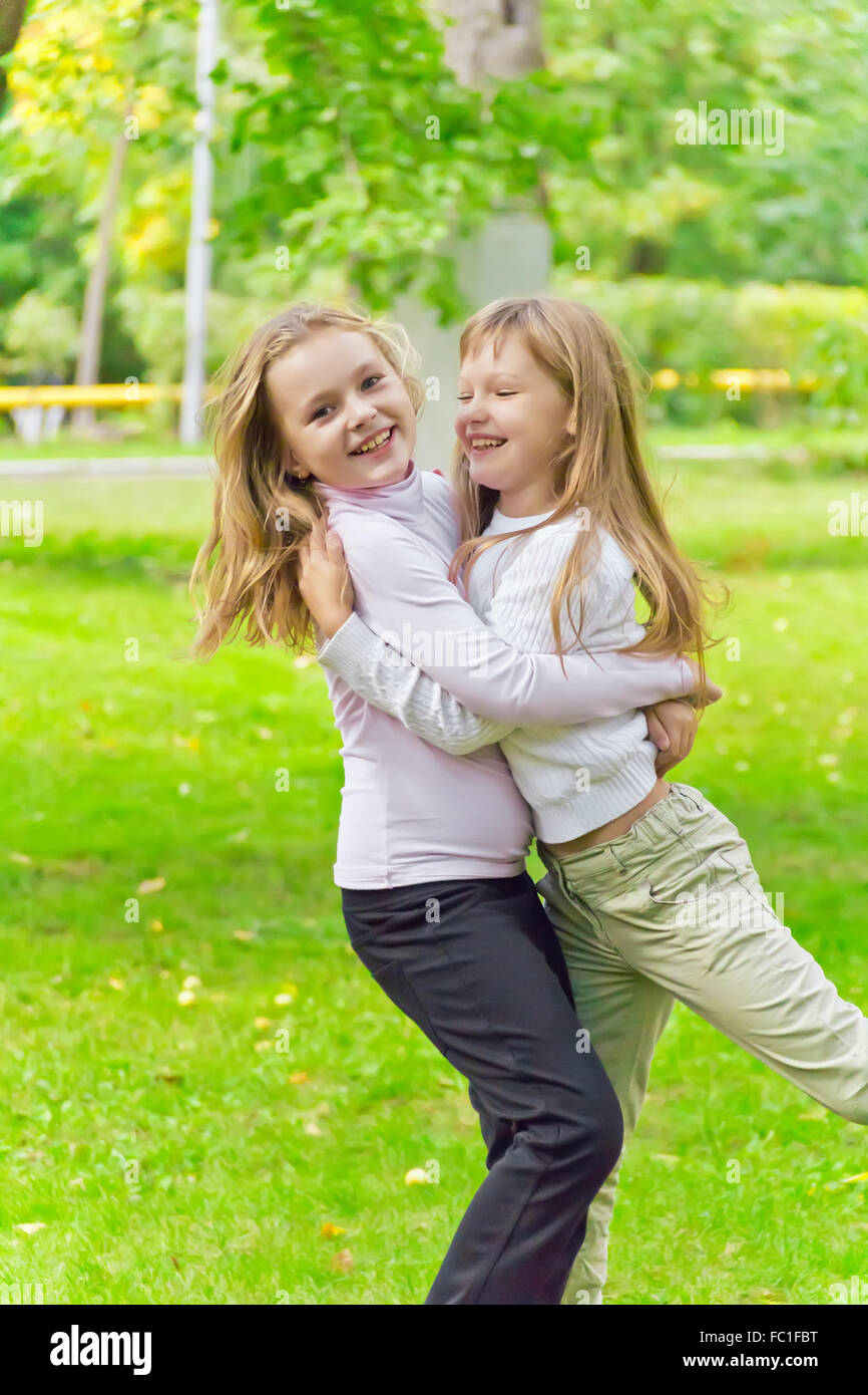 Cute two playing girls Stock Photo - Alamy