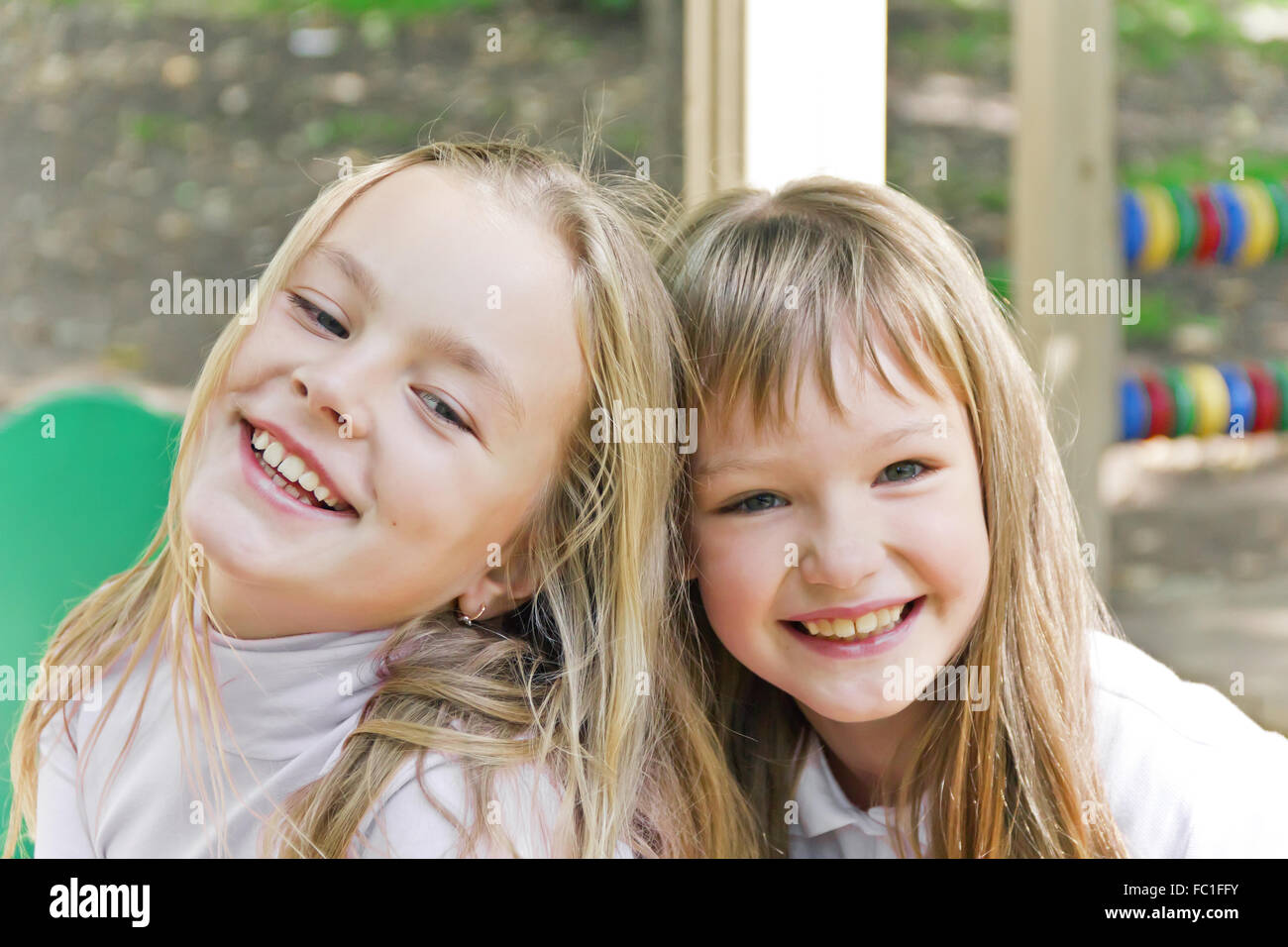 Cute two smiling girls Stock Photo - Alamy