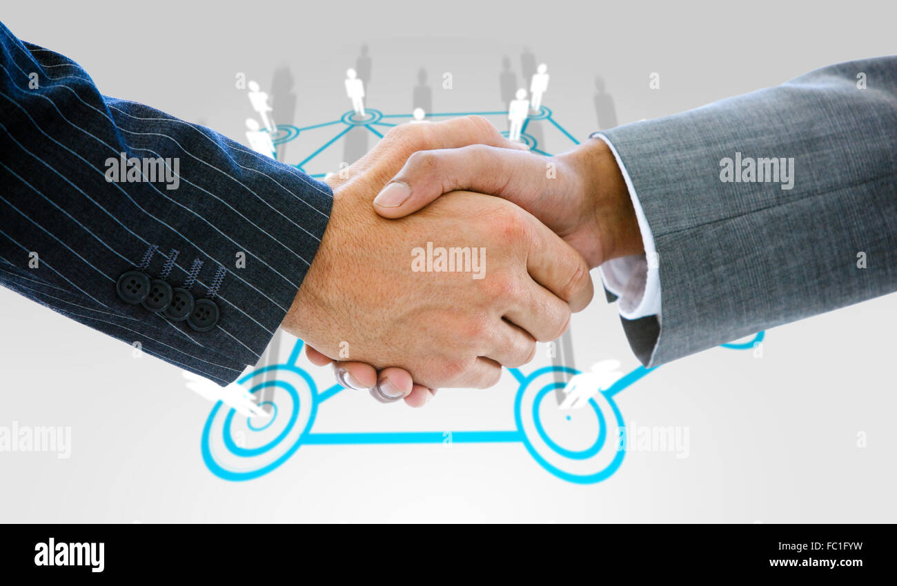 Composite image of business people shaking hands Stock Photo - Alamy